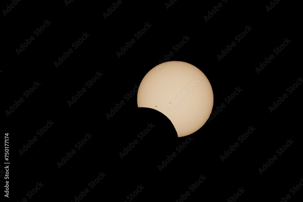 Partial solar eclipse with sun spots captured during the annular solar ...