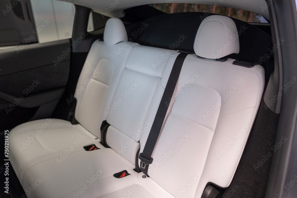 closeup Interior, white leather back seats Tesla model Y electric car ...