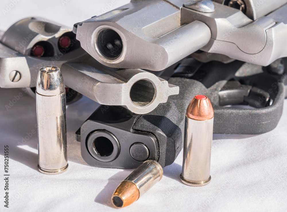 Three handguns, two revolvers and a pistol along with three hollow ...