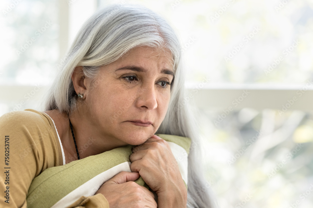 Frustrated desperate elderly Hispanic lady upset about loss, grief ...
