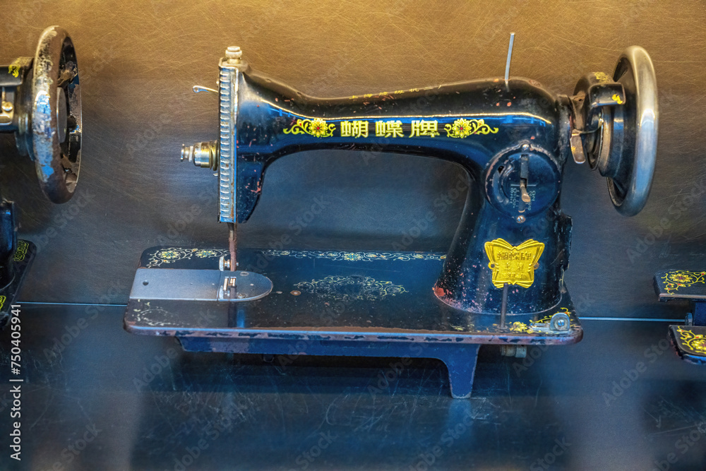 Antique Sewing Machine with Gold Detailing on Display, a display at the ...