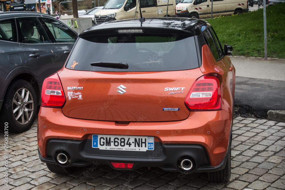 Foto de Lille - France - 28 february 2024 - rear view of orange suzuki ...