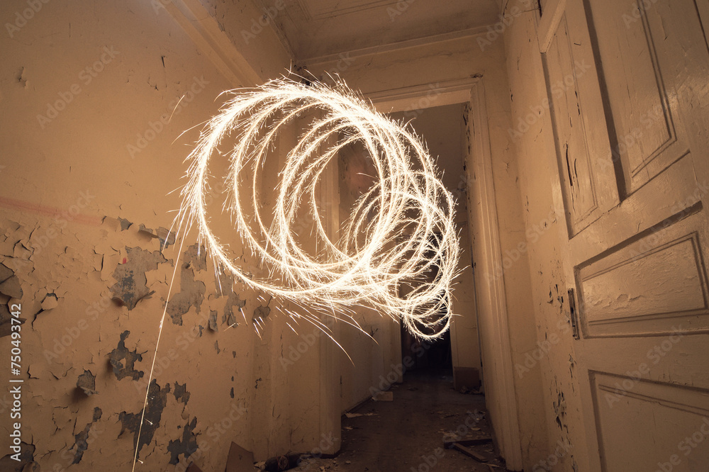 Spinning firework in corridor of old building. Rotating sparkling ...