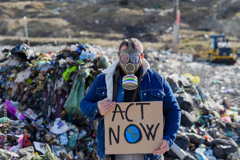 Man with gas mask holding placard, protest sign, standing standing on ...