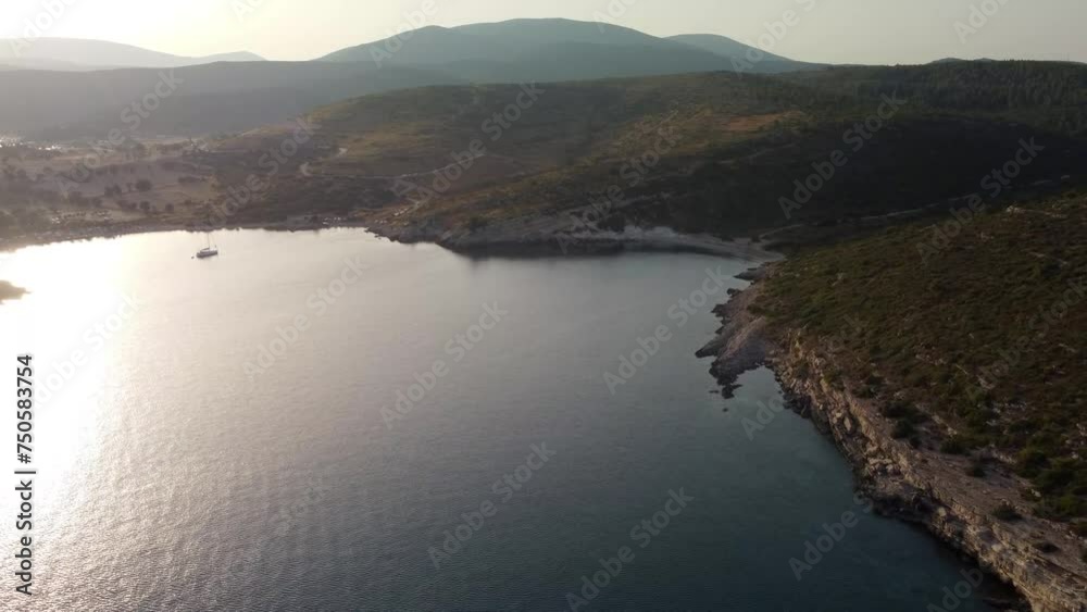 An expansive lake situated amidst towering mountains provides a ...