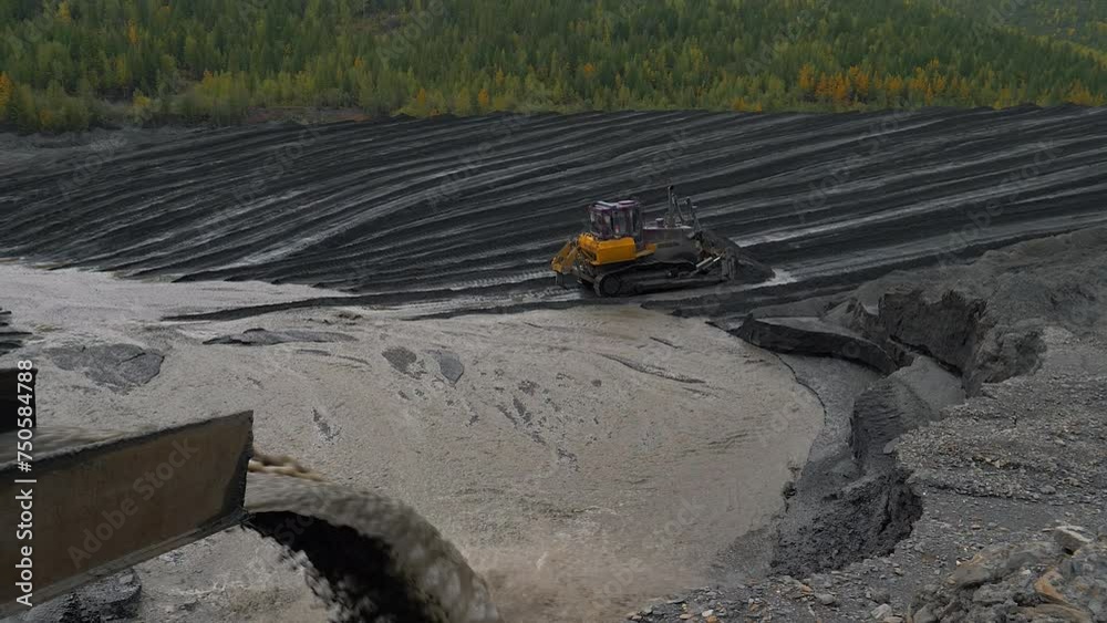 Heavy industrial machine operating at the open-pit mine. Heavy ...