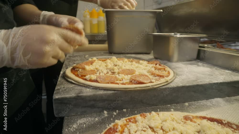 Chefs are making the tasty pizza at the restaurant kitchen. Kitchen ...