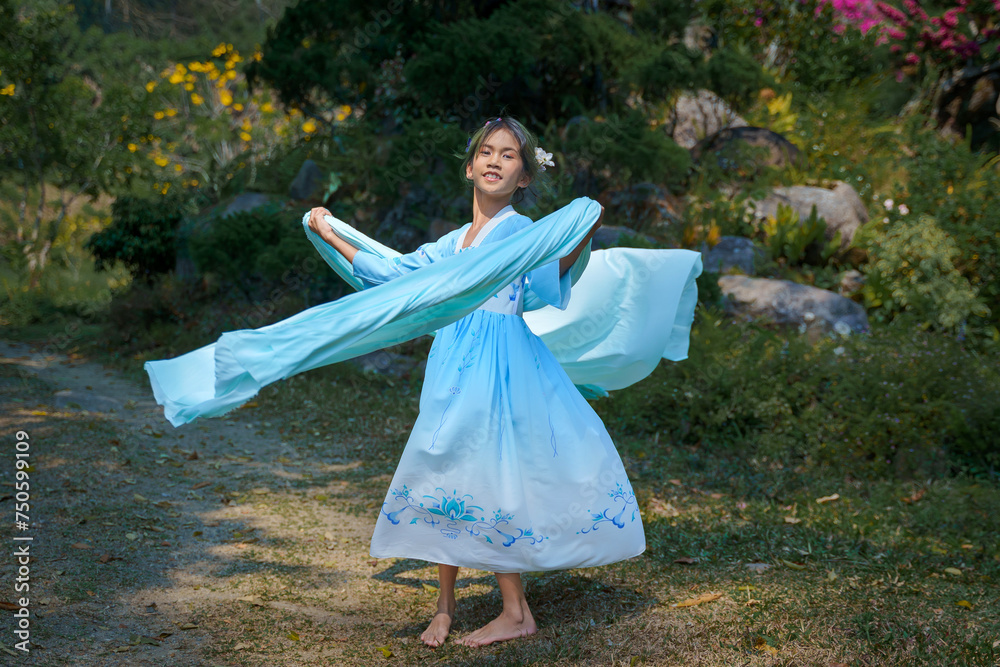 Pretty Asian girl in a beautiful elegant ancient Chinese costume ...
