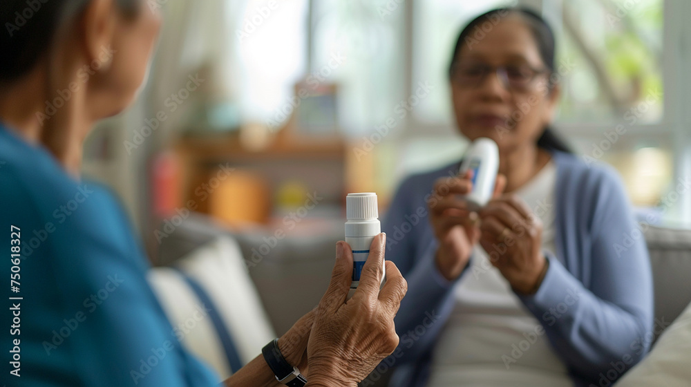 A health visitor teaching a patient how to use a peak flow meter for ...