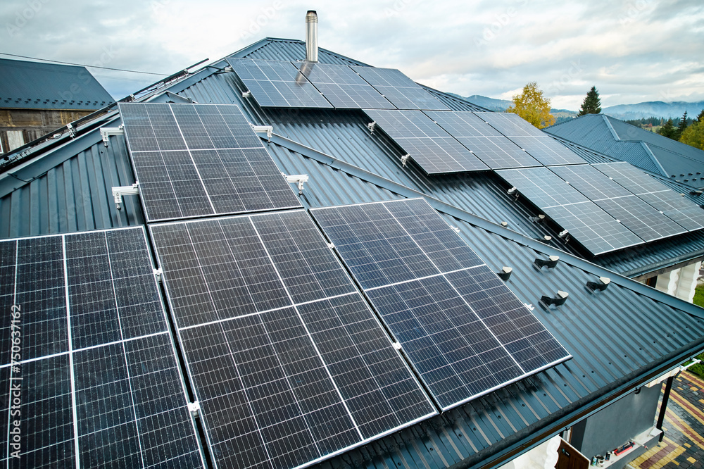 Photovoltaic solar panel system on the roof of house. Modern solar ...
