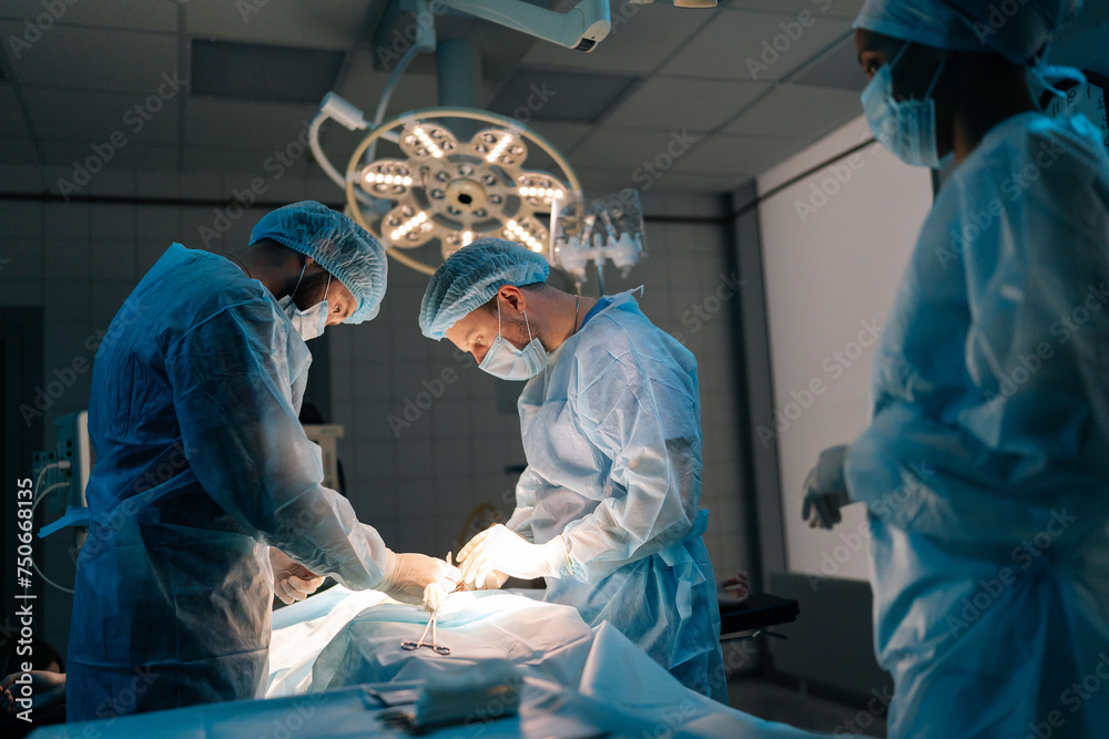 Multiethnic cooperating team of doctors, surgeons and African-American ...