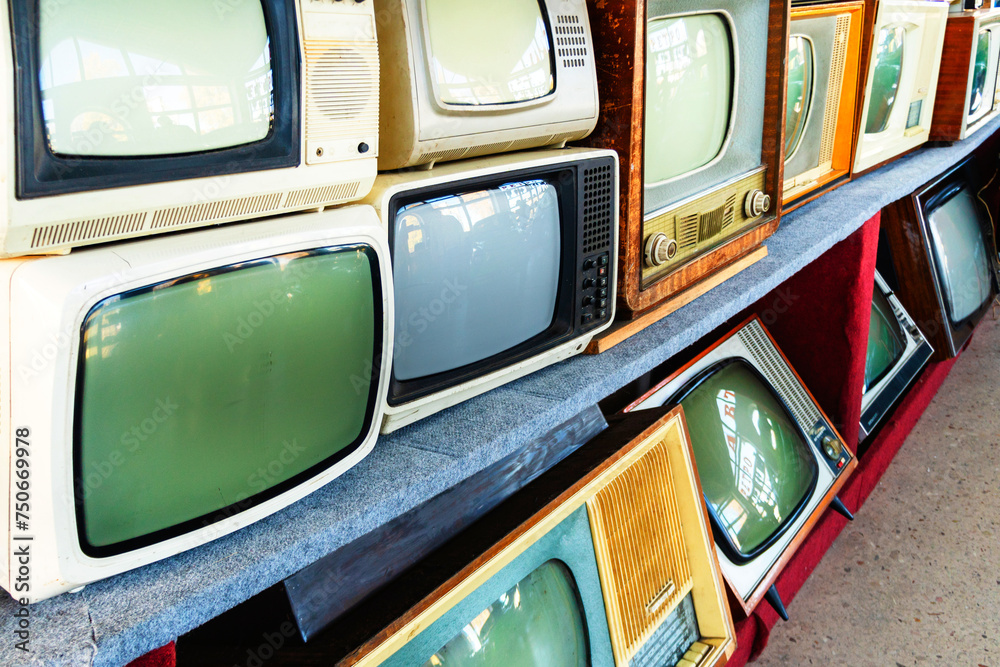 Many retro television. vintage old TV is colorful multi-row. Seeing the ...