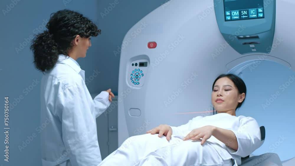 Medical facility's modern technology and MRI machine. Patient seating ...