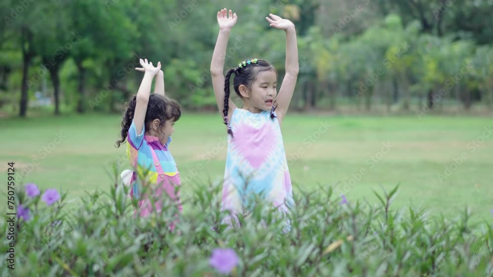 Happy two young girls raising hands together in park, Cute Little Girl ...