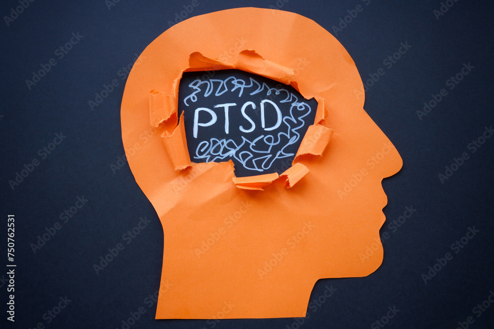 Torn paper head and abbreviation PTSD Post Traumatic Stress Disorder ...