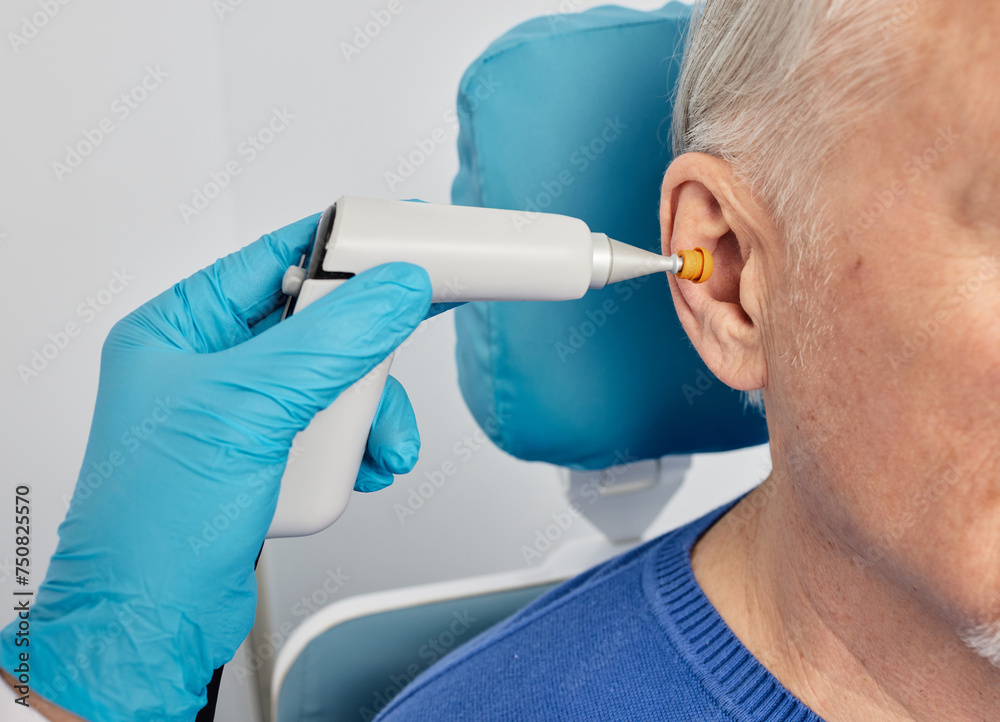 Portrait of mature man while tympanometry and test of middle-ear ...