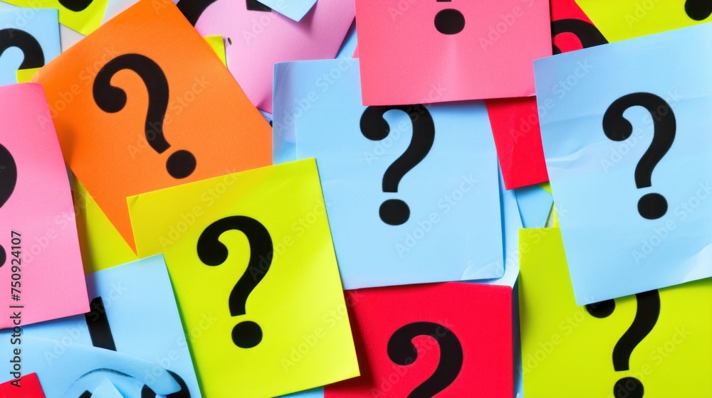 a pile of colorful post - it notes with question marks on them and a ...