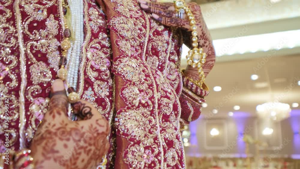 Close up footage of Woman dressed in red traditional Indian clothes ...
