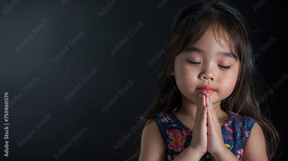 Little girl praying in the morning. Child praying with eyes closed ...