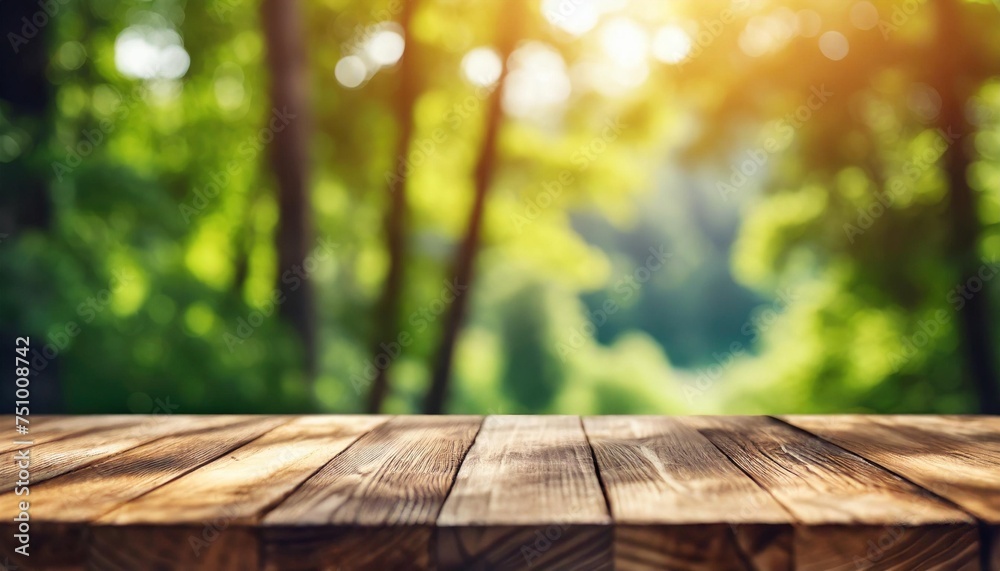 wooden table top focuses on the blurred background of trees in the ...