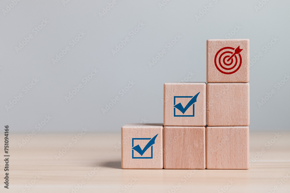 Wooden block with target goal icon with correct checklist. Business ...