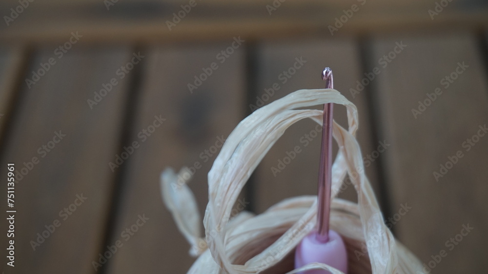 raffia balls . A bobbin of yarn lies on hooks. side view of a textile ...