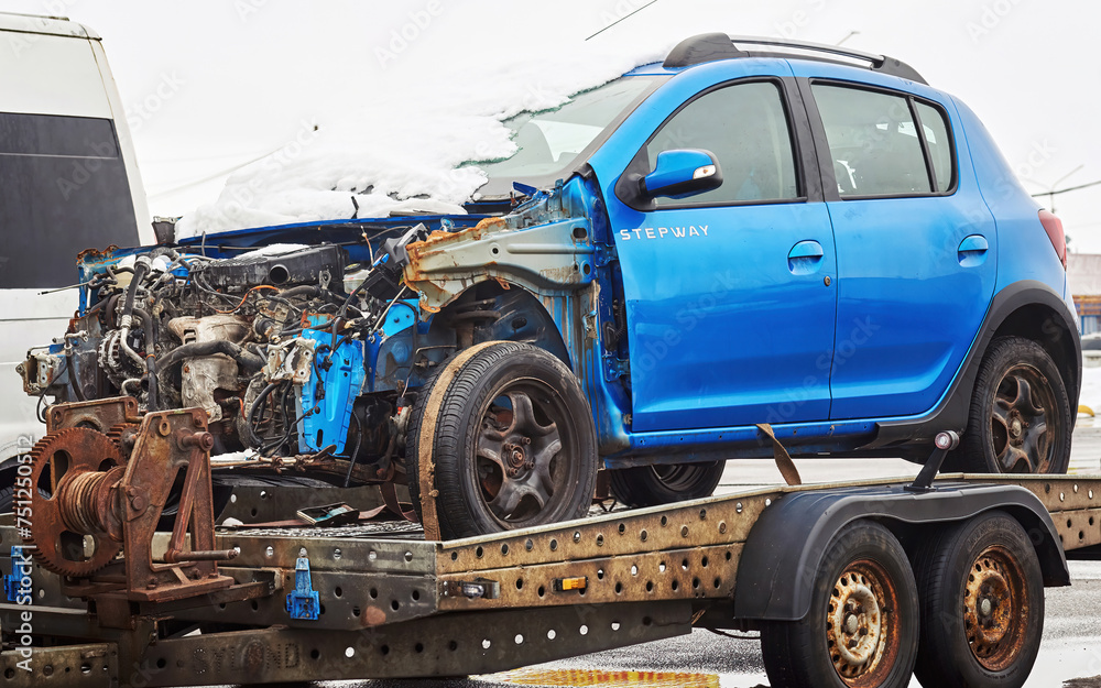 Minsk, Belarus. Jan 24, 2024. Wrecked car on tow truck. Renault Sandero ...