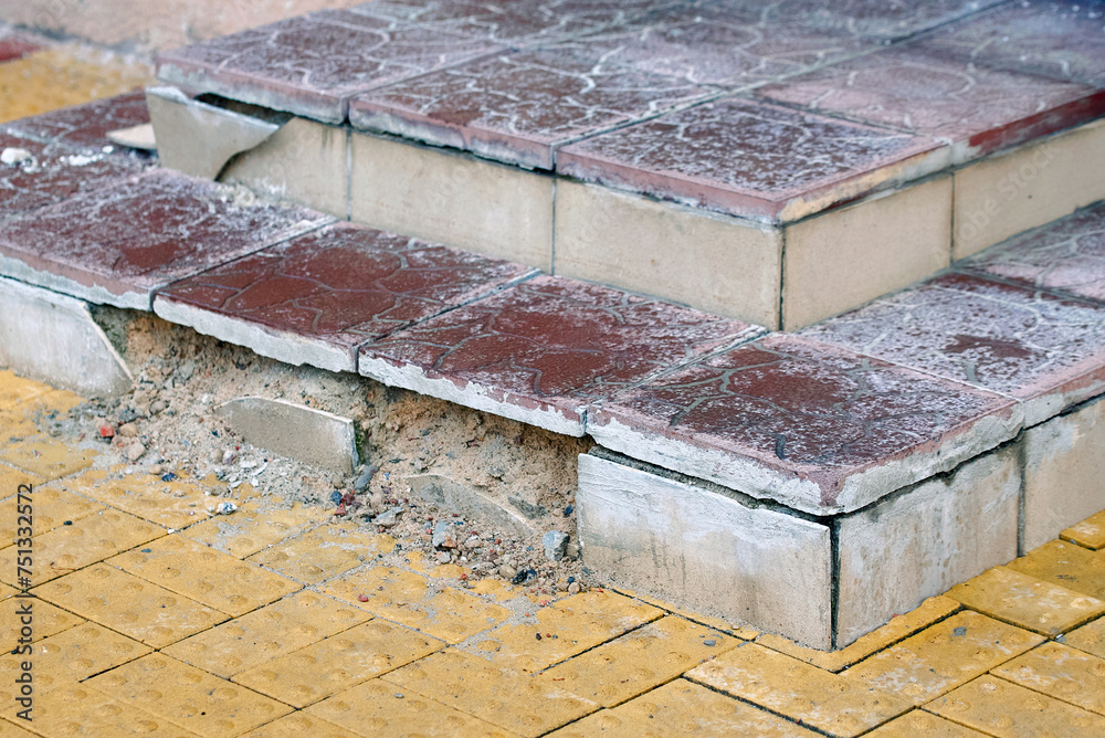 Broken tiled front porch stairs, damaged steps need renovation closeup ...