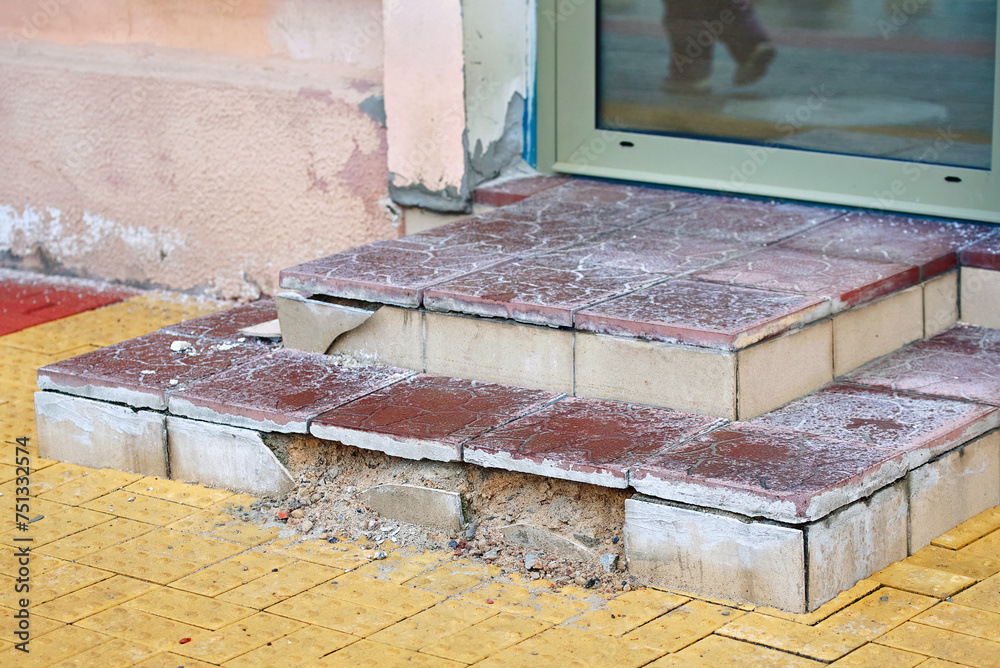 Damaged concrete front steps, old porch with broken loose tiles. Broken ...