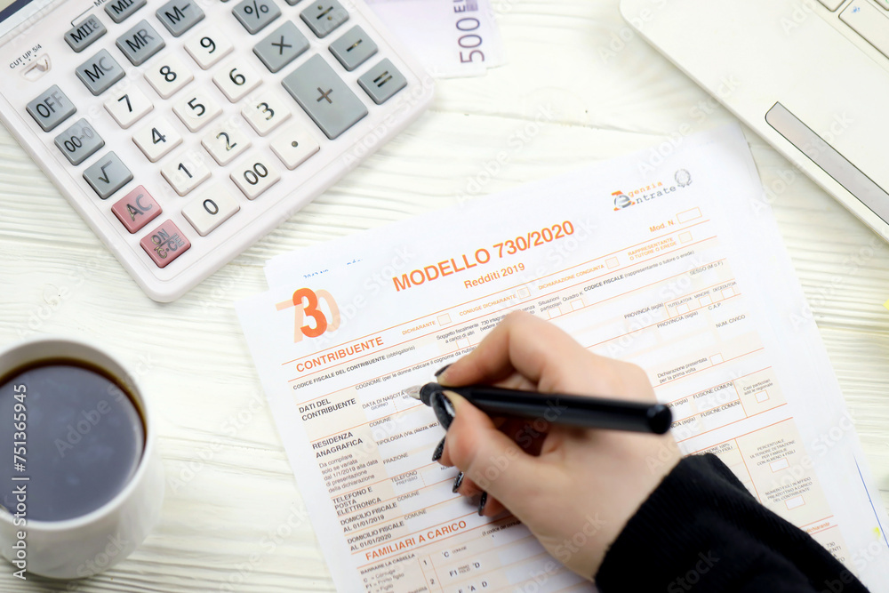 KYIV, UKRAINE - OCTOBER 31, 2023 Accountant fill italian tax form ...