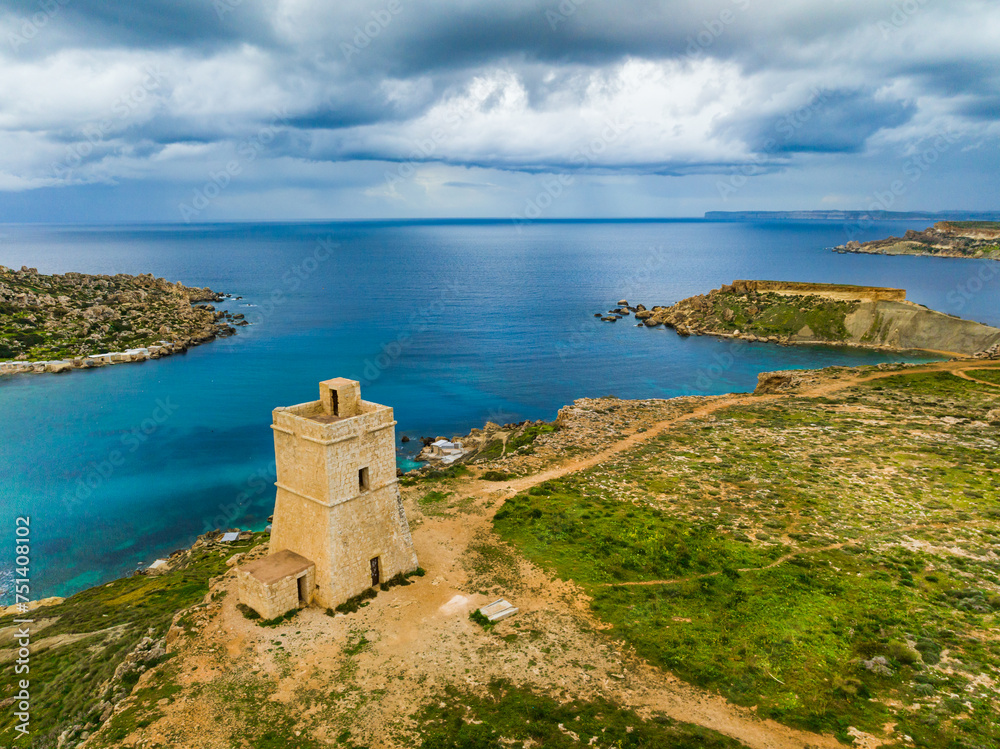 Drone aerial view of tower. Maltese nature landscape, stormy sky, sea ...