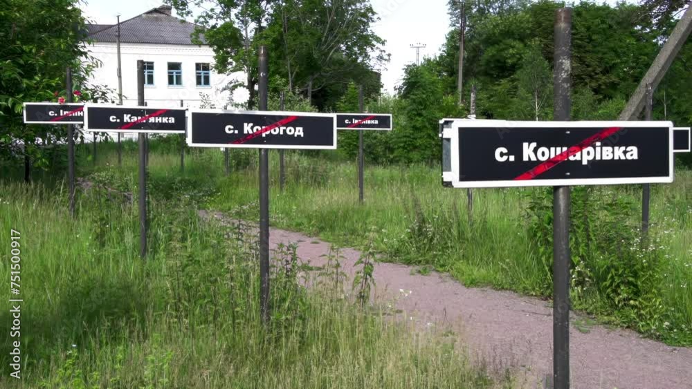 Black signs with the names of disappeared, destroyed villages in the ...