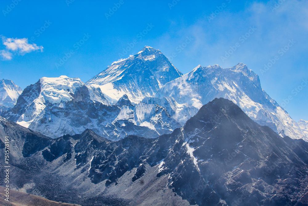 Everest west face and the western wall of Nuptse rise dramatically ...