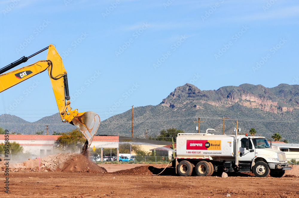 At a construction site in Apache Junction, Arizona, dust control is ...