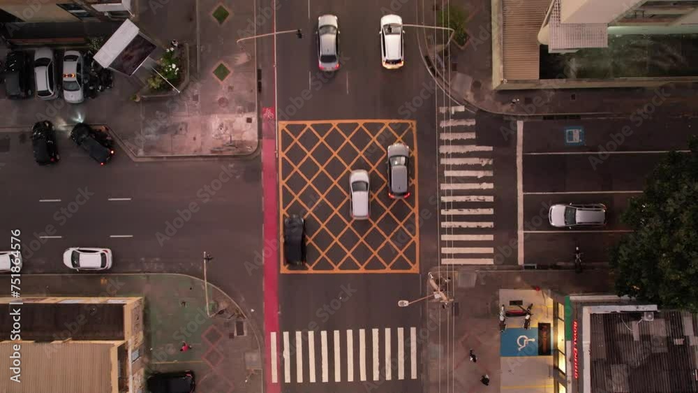 Cars in intersection with traffic safety paintings, traffic lights and ...