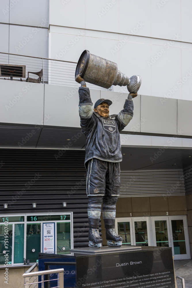 A bronze statue of LA Kings hockey player Dustin Brown holding the ...