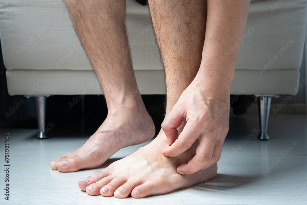 Men wear canvas shoes, he scratches legs and feet with itchy skin ...