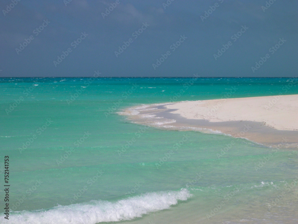 Turquoise sea water and blue sky in Tropic of Cancer Beach, Little ...