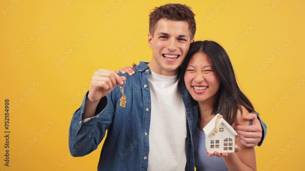 Vidéo Stock Young multiracial homeowner couple holding and showing the ...