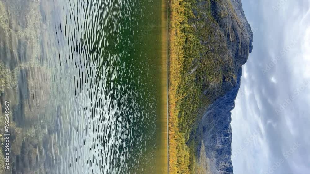 Golden autumn in the Arctic mountains beyond the Arctic Circle. View of ...