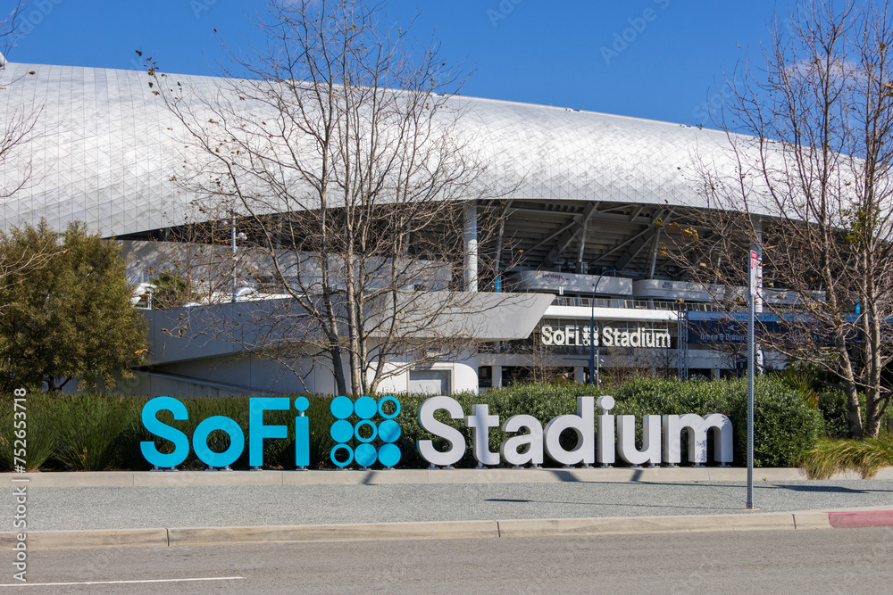 A beautiful spring landscape at SoFi Stadium with lush green palm trees ...