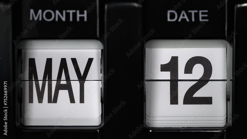 retro flip calendar with a date change from the eleventh of May to the ...