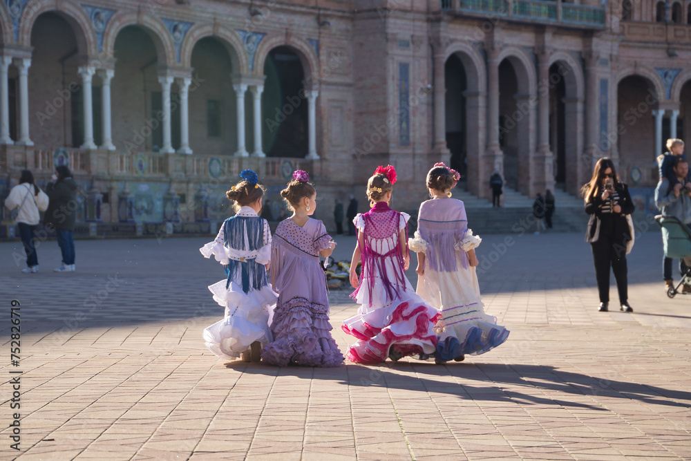 Four girls dancing flamenco, back to back, walking while talking, in ...