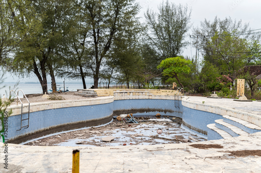 Derelict Swimming Pool by Seashore with Overgrown Trees Stock Photo ...