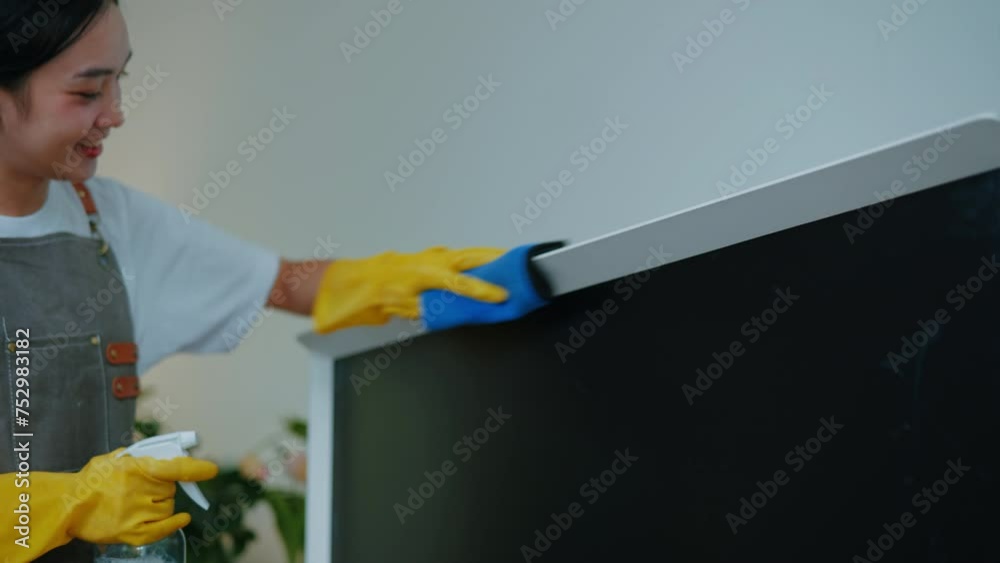 Female housekeeper is spaying detergent cleaner and disinfection on ...