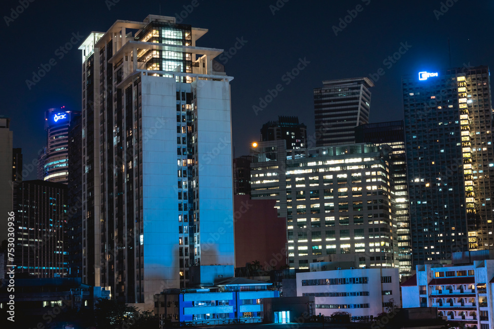 Makati, Philippines - Illuminated skyscrapers dominate the night sky in ...
