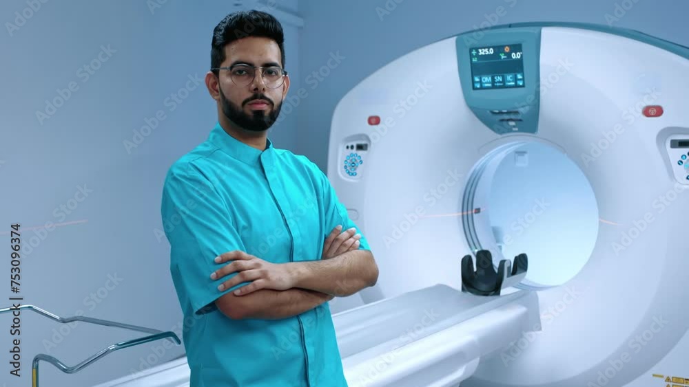 Indian tomography specialist posing with crossed arms. Serious doctor ...