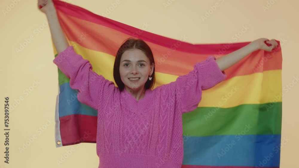 An adult protest woman showing multicolor LGBT flag, as symbol of ...
