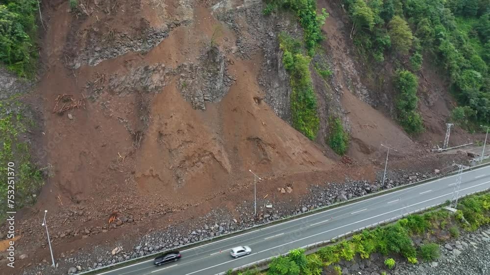 Mountain soil collapse in half of the highway. Landslides due to heavy ...