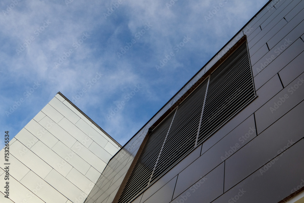 The exterior wall of a contemporary commercial style building with ...
